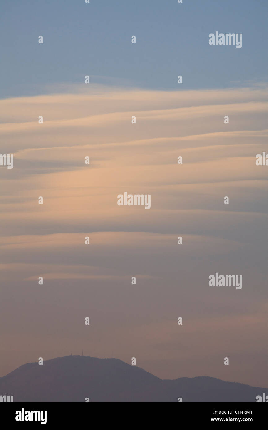 Lenticular cloud formation (Altocumulus lenticularis) at sunrise over ...