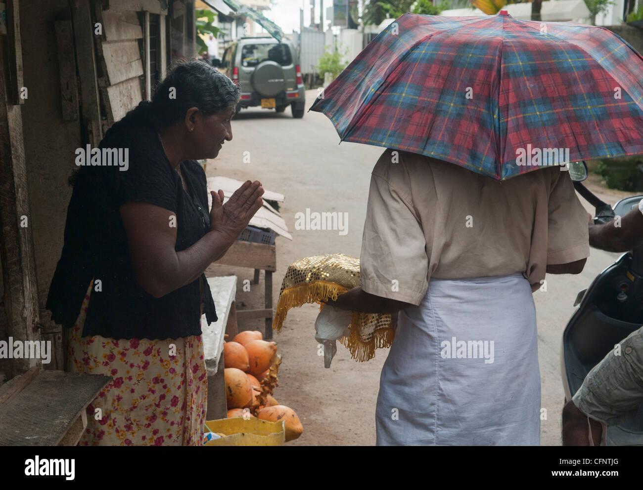 giving alms in Galle, Sri Lanka Stock Photo - Alamy