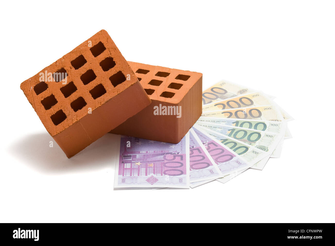 Bricks with money over white background - mortgaging concept Stock ...