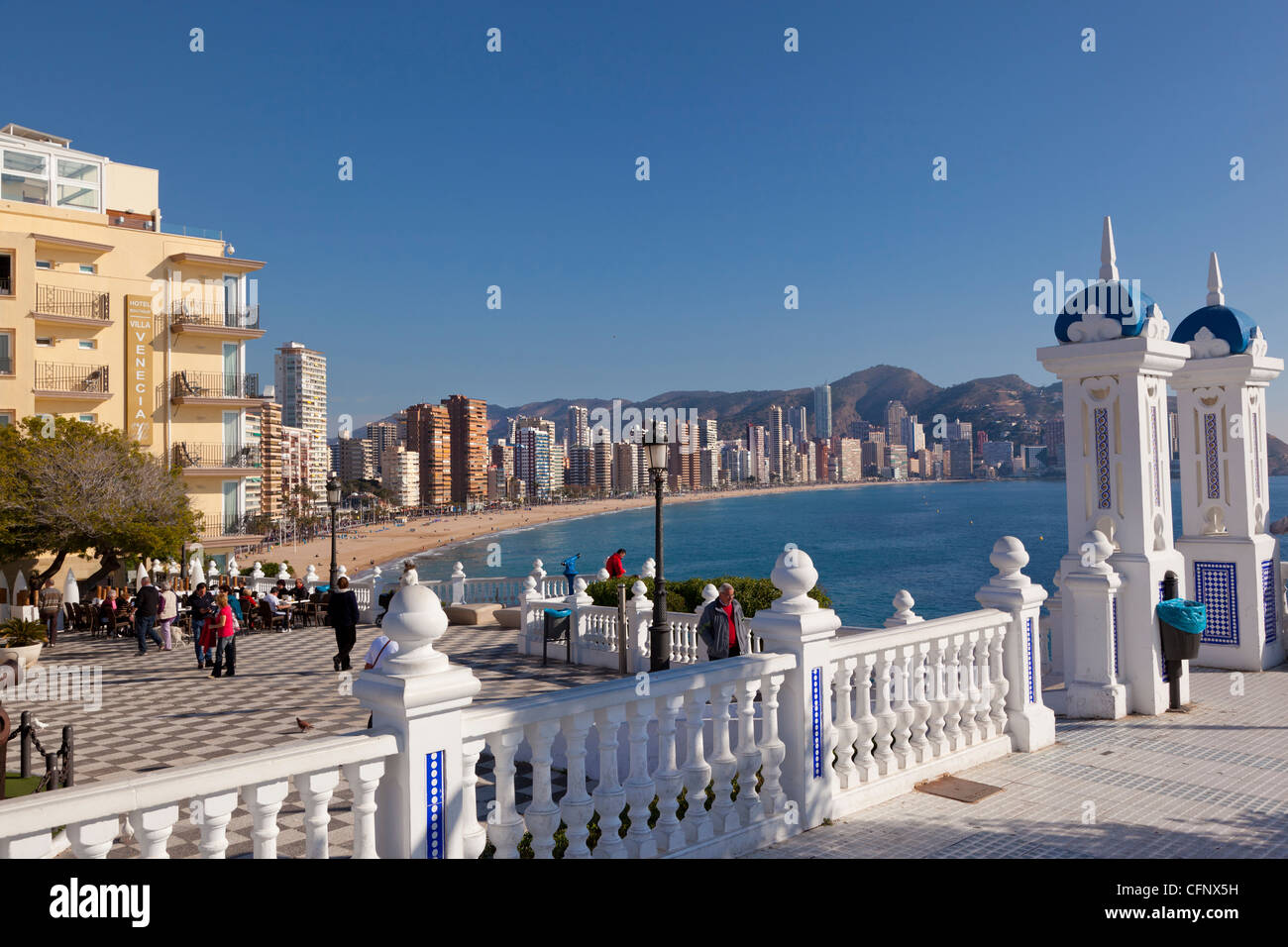 Panoramic of Benidorm's old town terrace, with people enjoying a walk ...