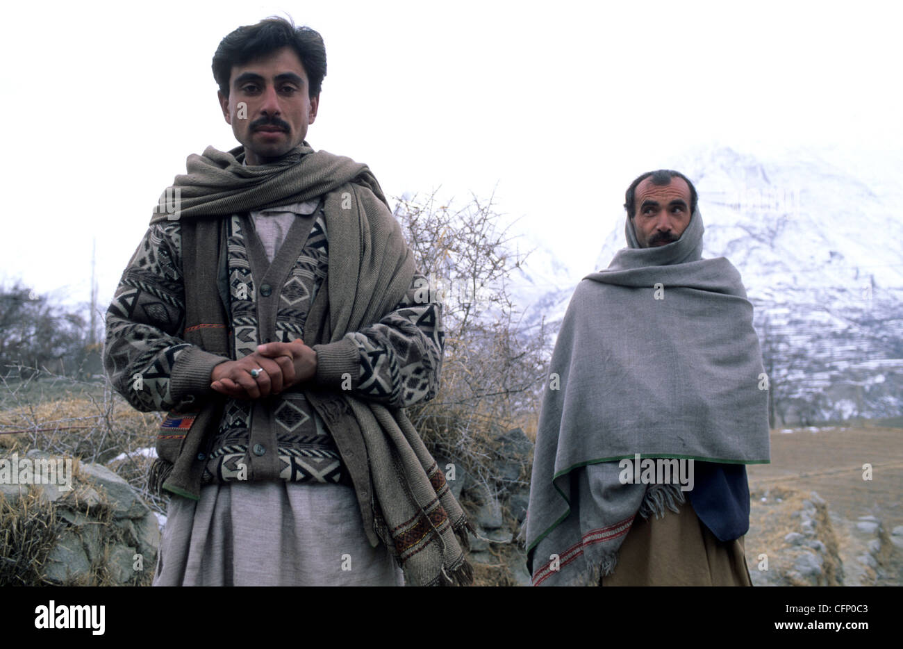 Two Pakistani men between the Karakoram Mountains, Hunza Valley ...