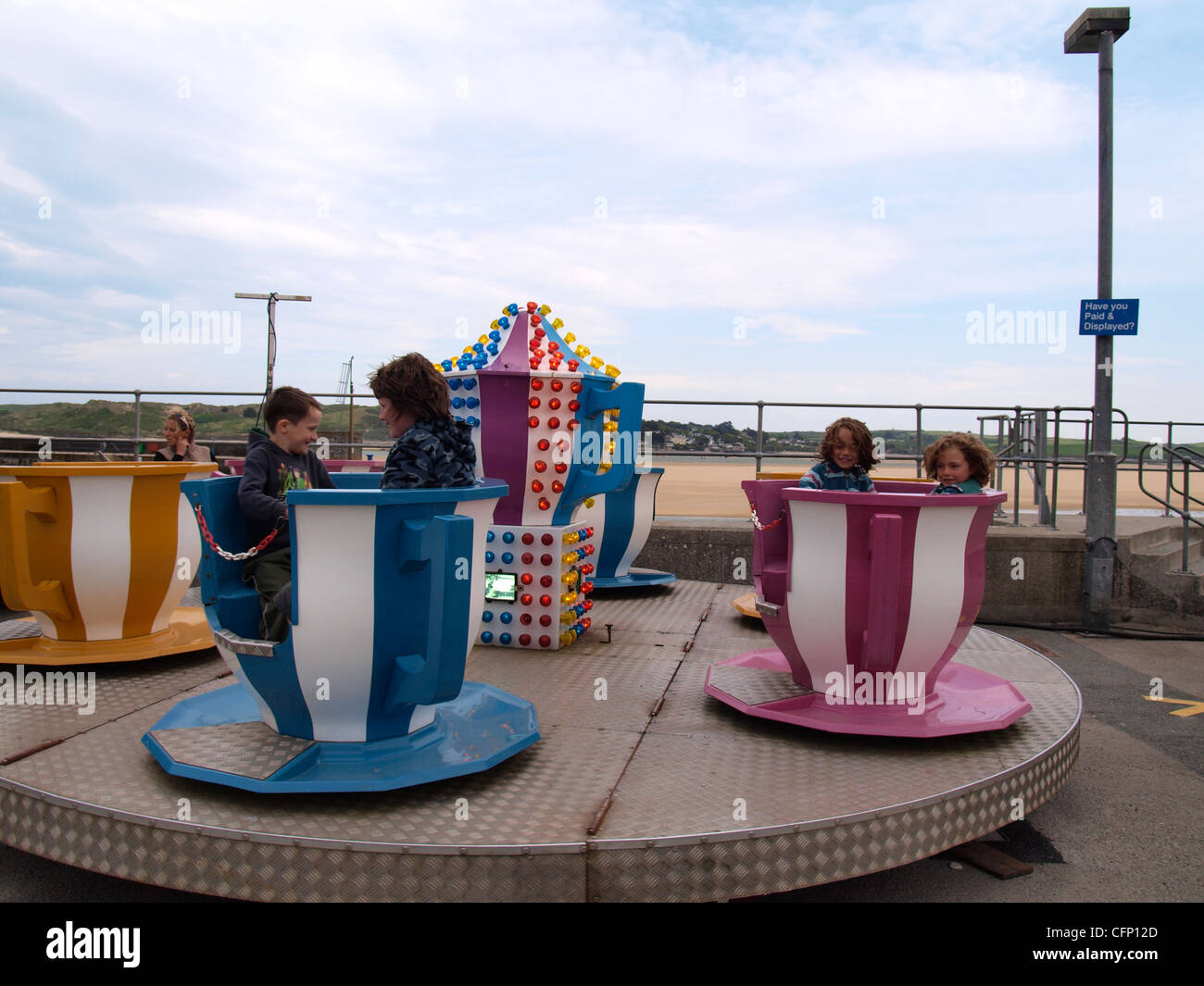 Children on a fairground ride at the seaside, UK Stock Photo - Alamy