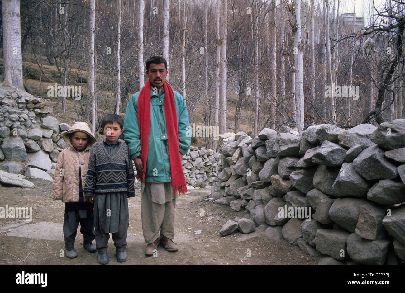 Portrait of a father with his two sons around Karimabad, Hunza Valley ...