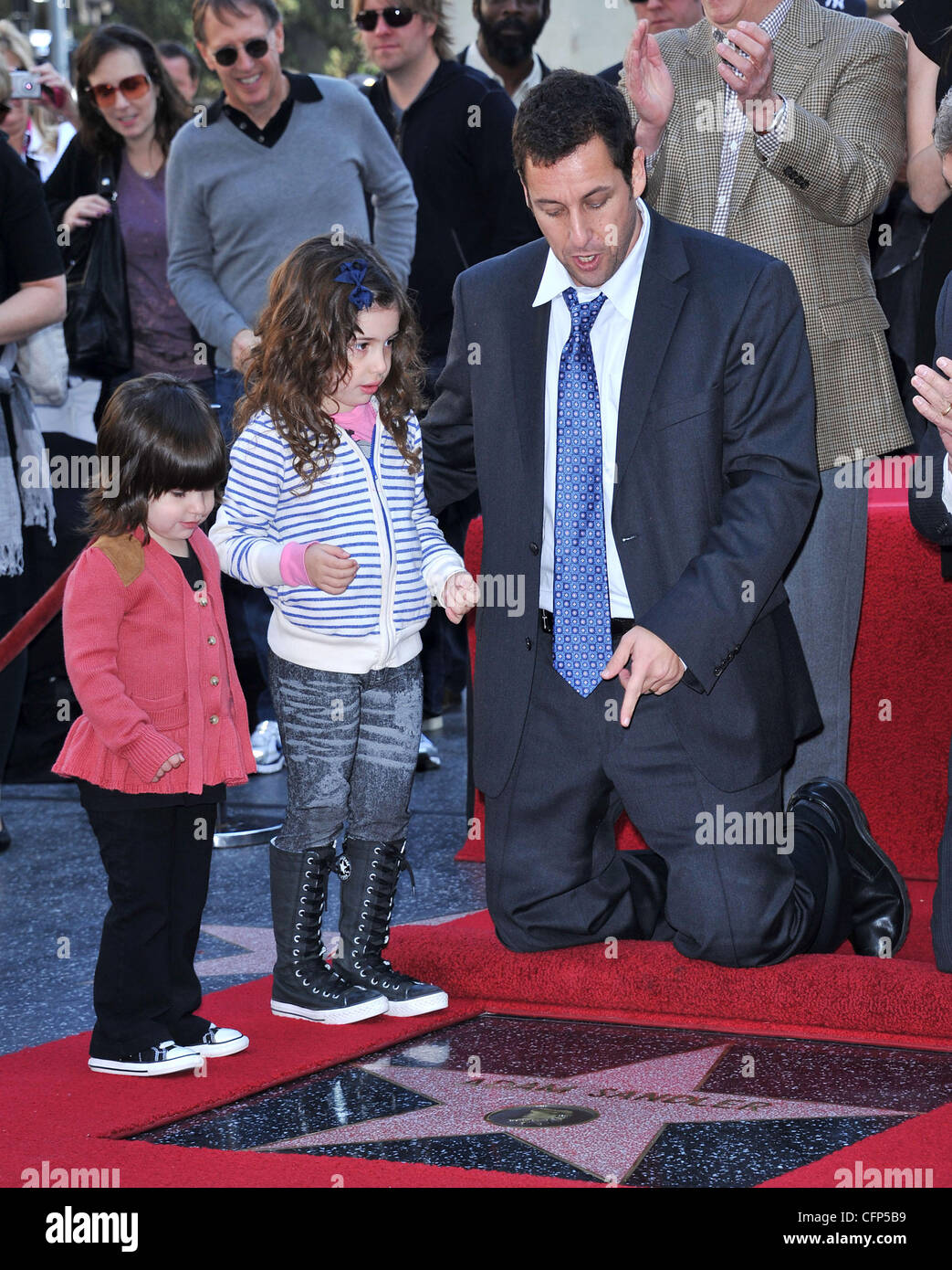 Adam Sandler with his daughters Sunny and Sadie Adam Sandler is honored ...