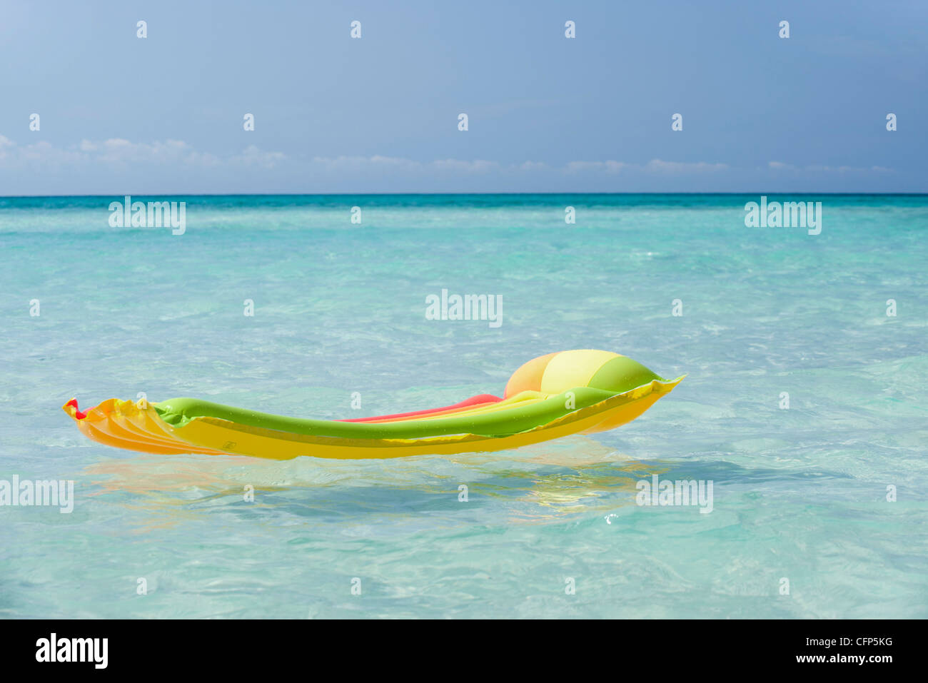 Pool raft floating in ocean Stock Photo - Alamy