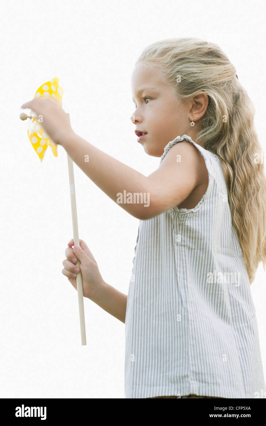 Little girl holding pinwheel Stock Photo - Alamy