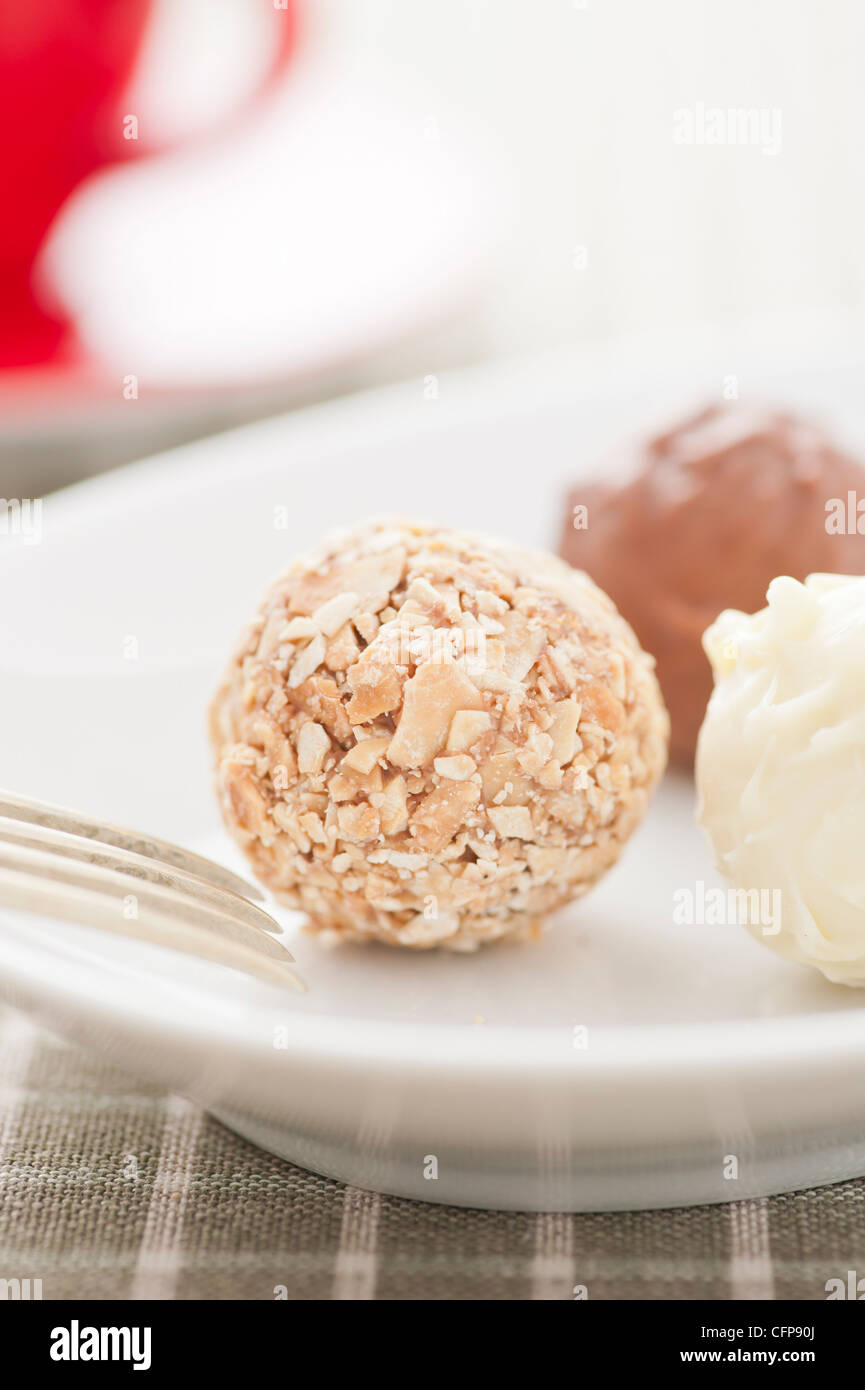Closeup of assorted chocolate truffles on a plate Stock Photo - Alamy