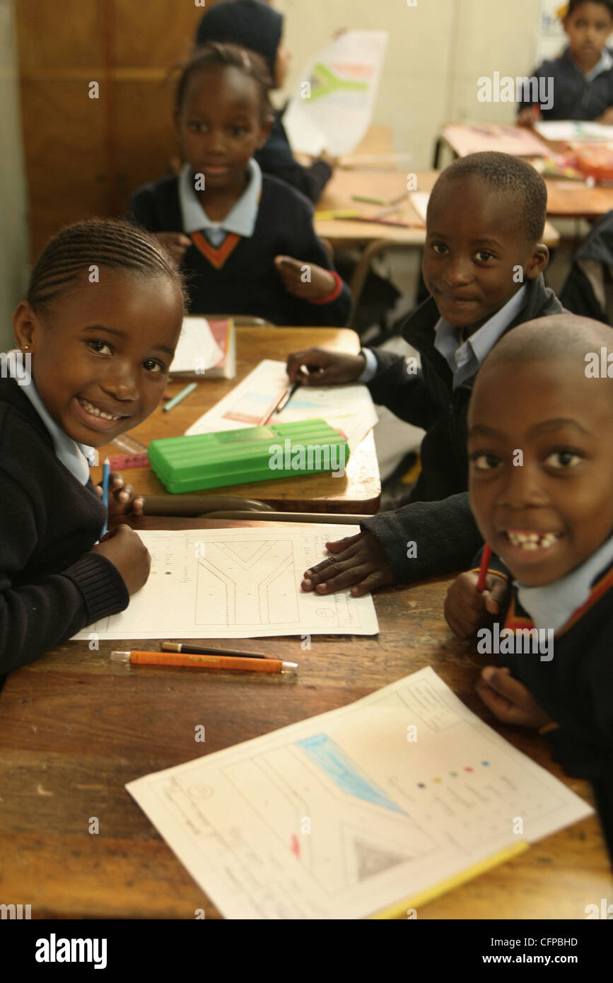 Learners doing class work at a community school in Johannesburg ...