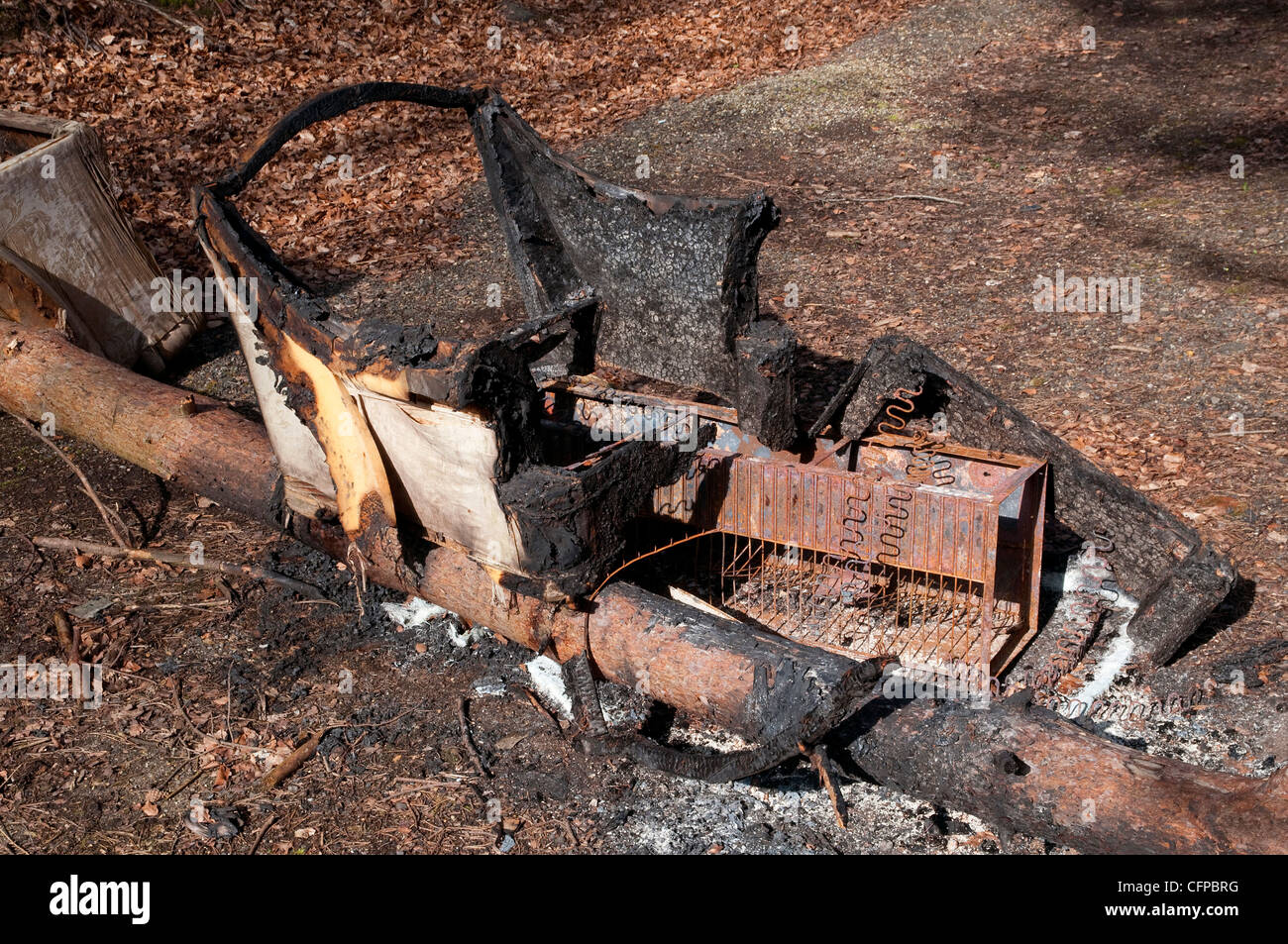 burnt out chair in countryside Stock Photo - Alamy