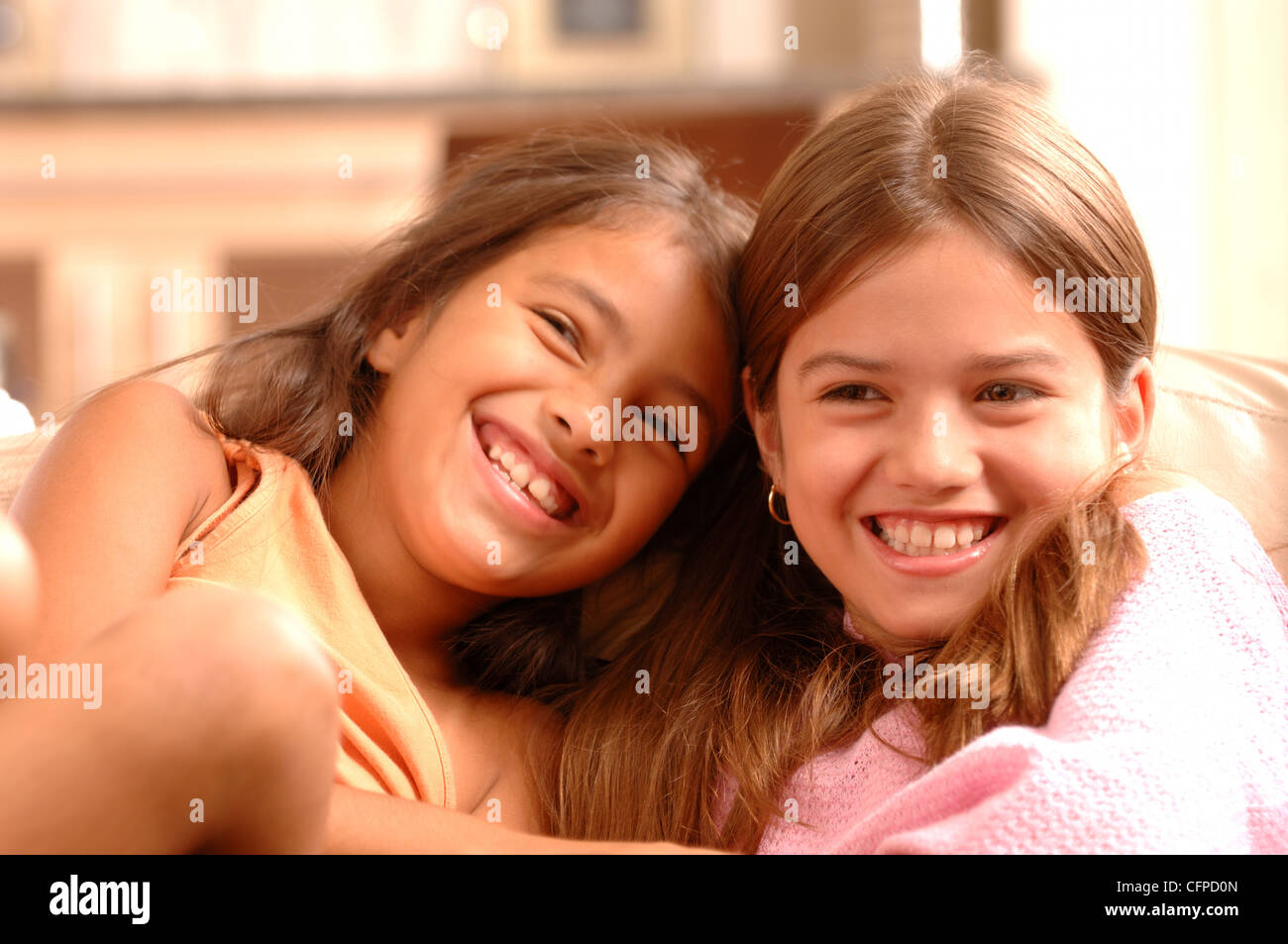 Close-up of Girls on Couch Stock Photo - Alamy