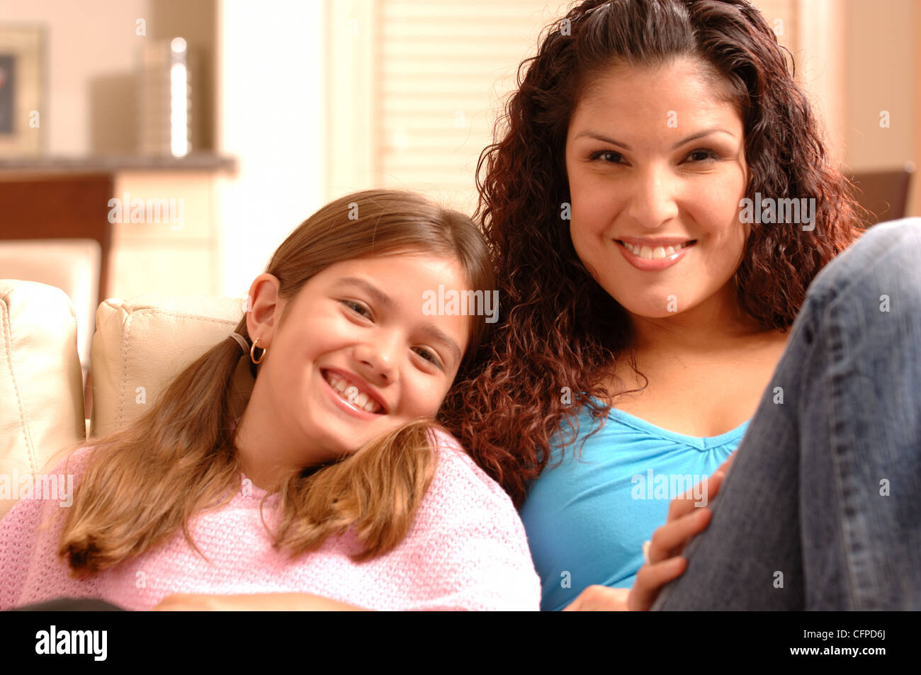 Mother and Daughter on Couch Stock Photo - Alamy