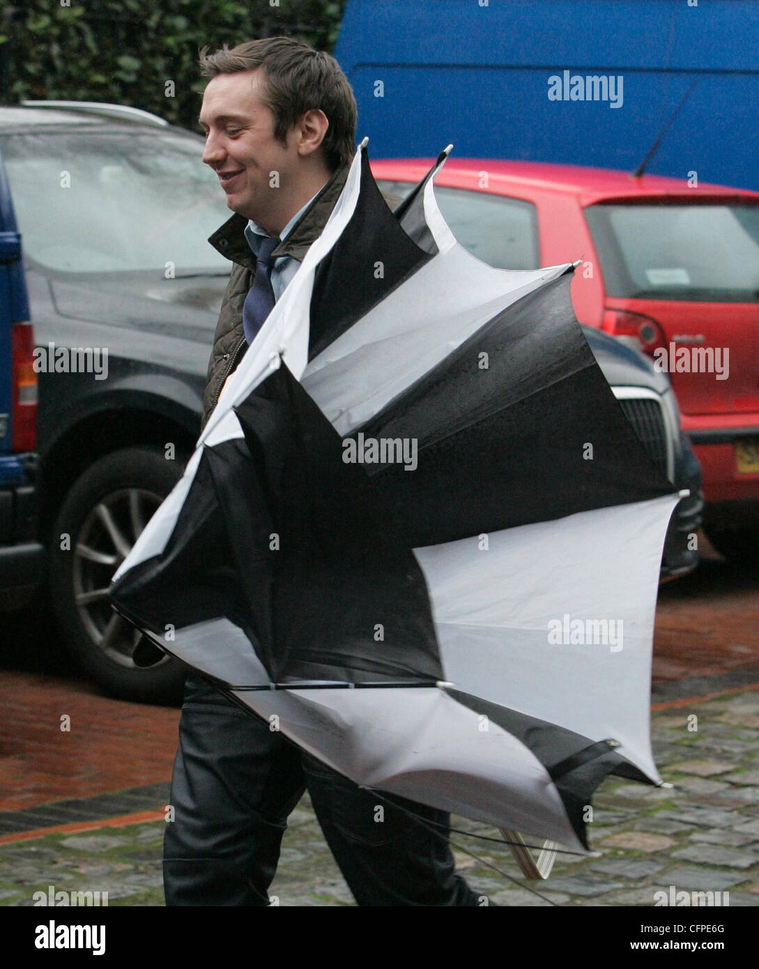 Craig Gazey has problems with his umbrella 'Coronation Street' cast ...