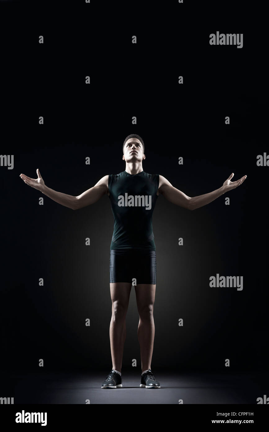Male athlete with arms outstretched, portrait Stock Photo - Alamy