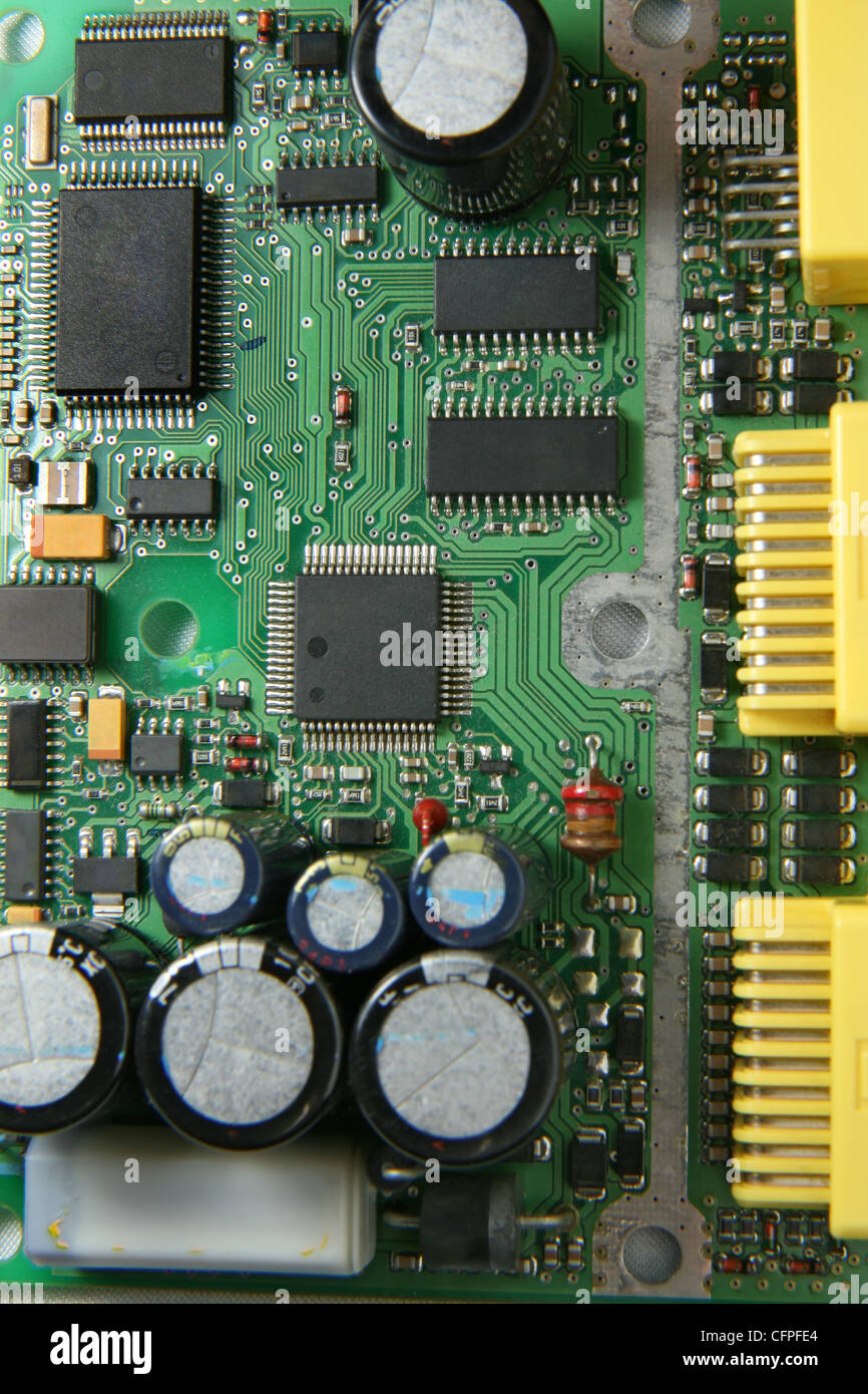 A printed circuit board with various electronic devices mounted on it ...