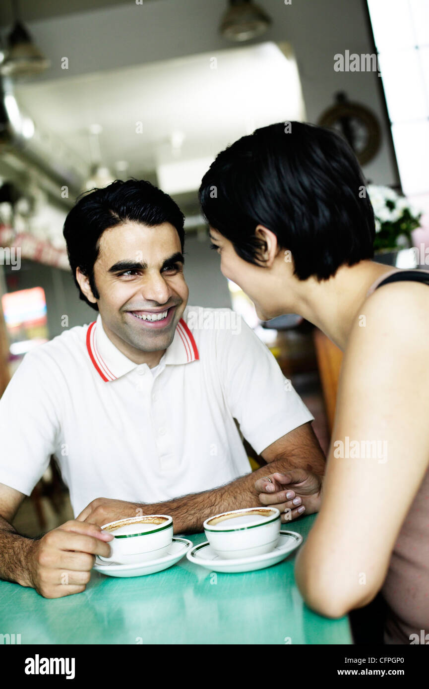 Couple Talking Over Coffee Stock Photo - Alamy