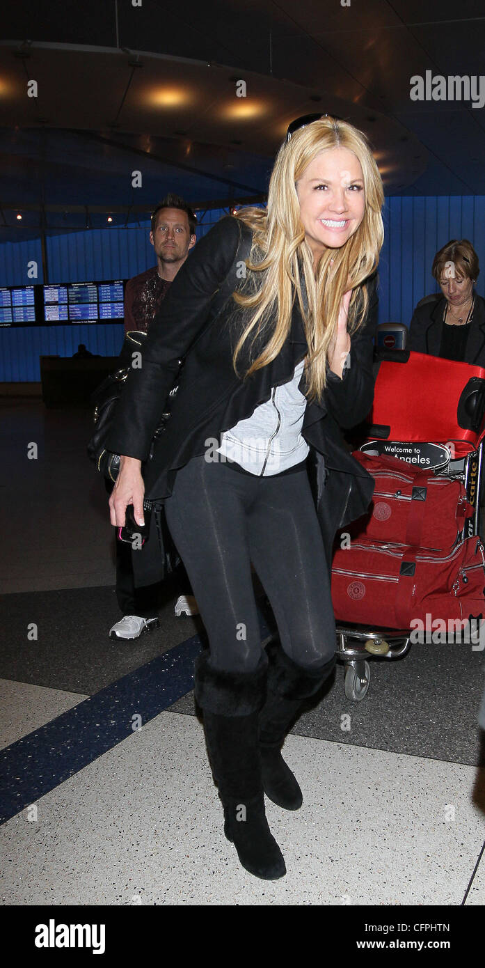 Nancy O'Dell and husband Keith Zubchevich arrive at LAX Los Angeles ...