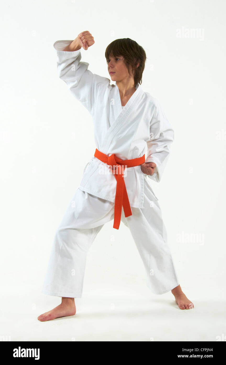 boy practicing karate on white background Stock Photo - Alamy