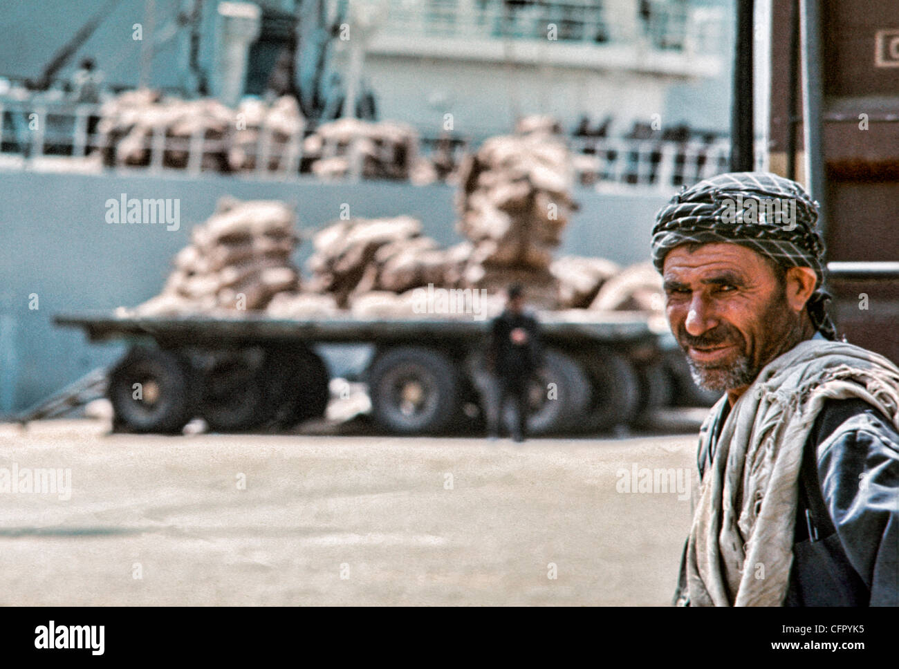 IRAN, BANDAR SHAHPUR: Iranian dock worker with freighter ships lined up ...