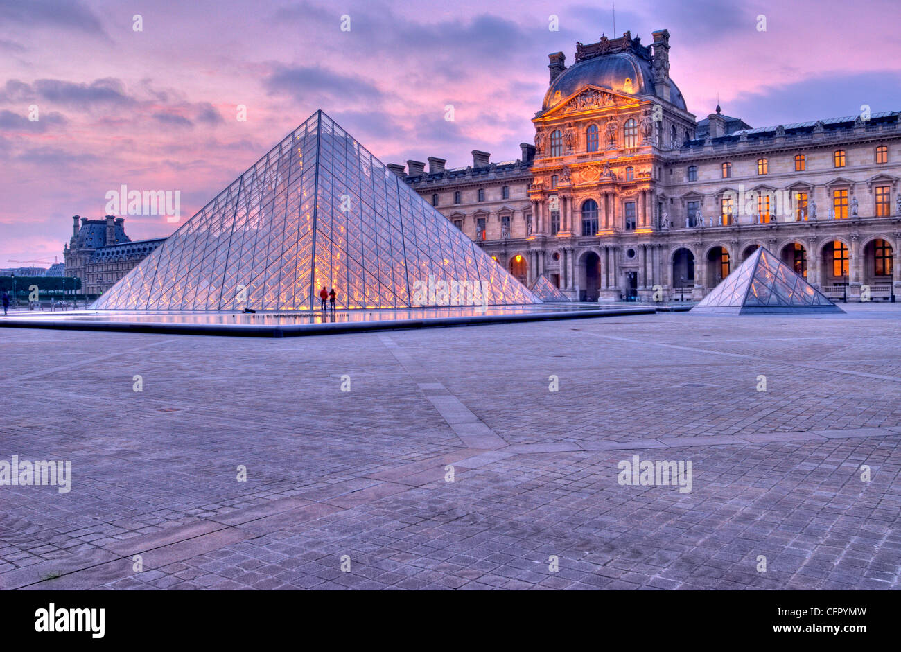 The Louvre at sunset with its glass pyramid entrance Stock Photo - Alamy