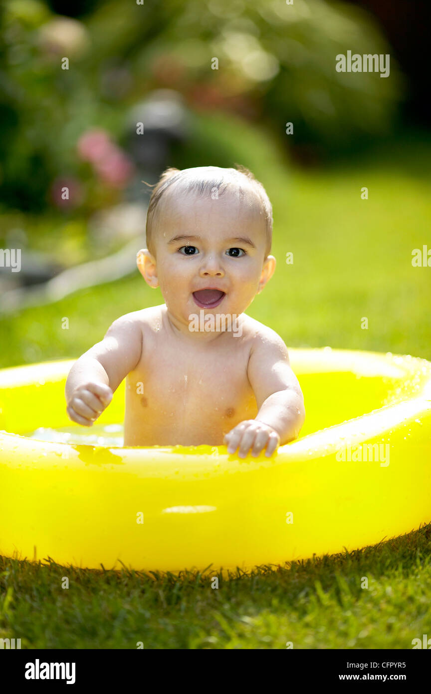 Baby Boy in Inflatable Pool Stock Photo - Alamy