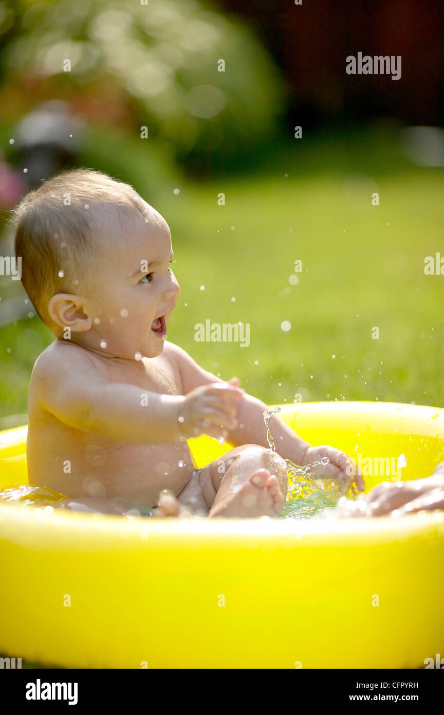 Baby Boy in Inflatable Pool Stock Photo - Alamy