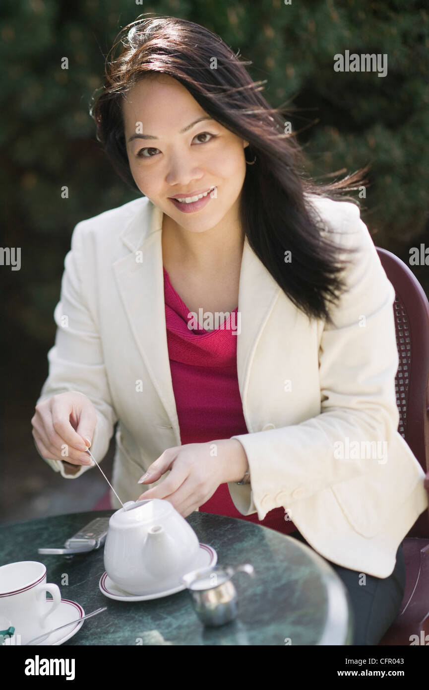 Asian Woman having Tea Stock Photo - Alamy