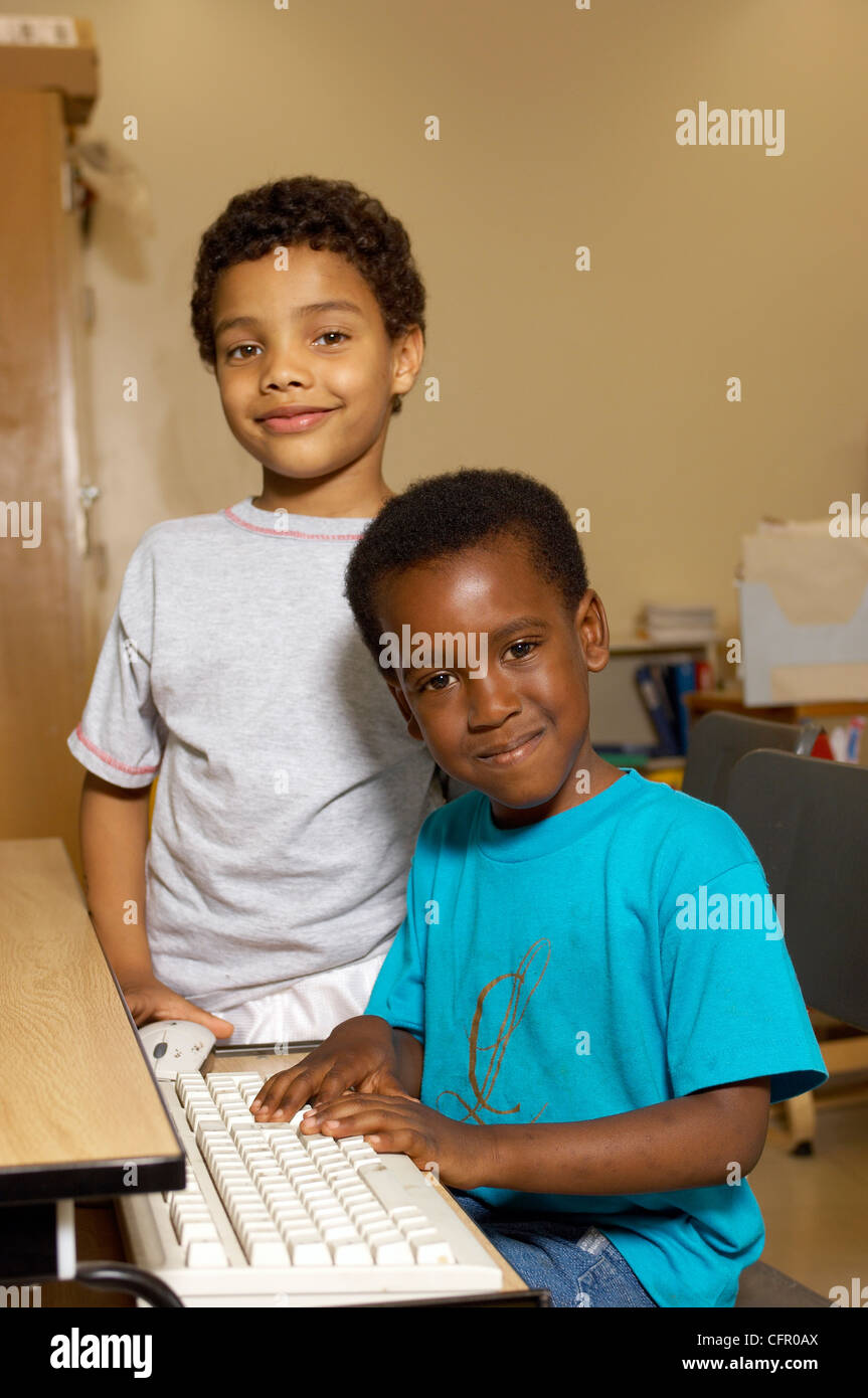 Boys at Keyboard in Classroom Stock Photo - Alamy