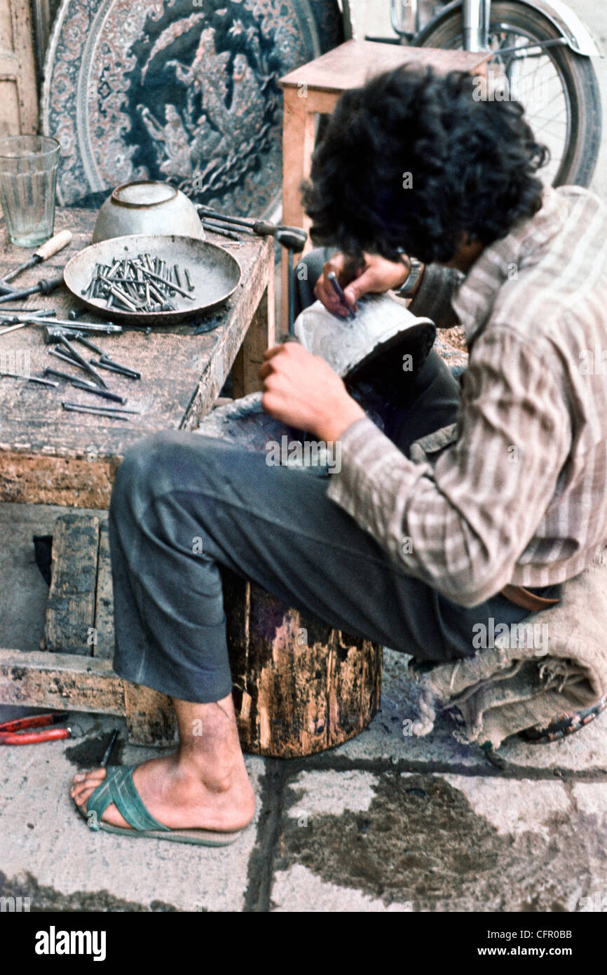 IRAN, ISFAHAN: Iranian artisan uses nails to hammer a traditional ...