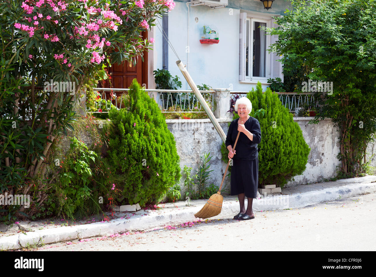 Lady with broom hi-res stock photography and images - Alamy
