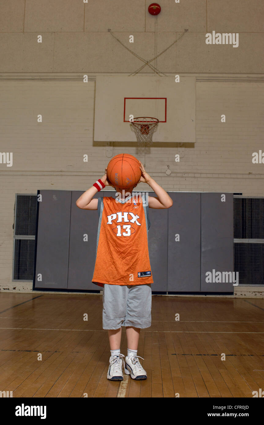 Boy Holding Basketball infront of Face Stock Photo - Alamy