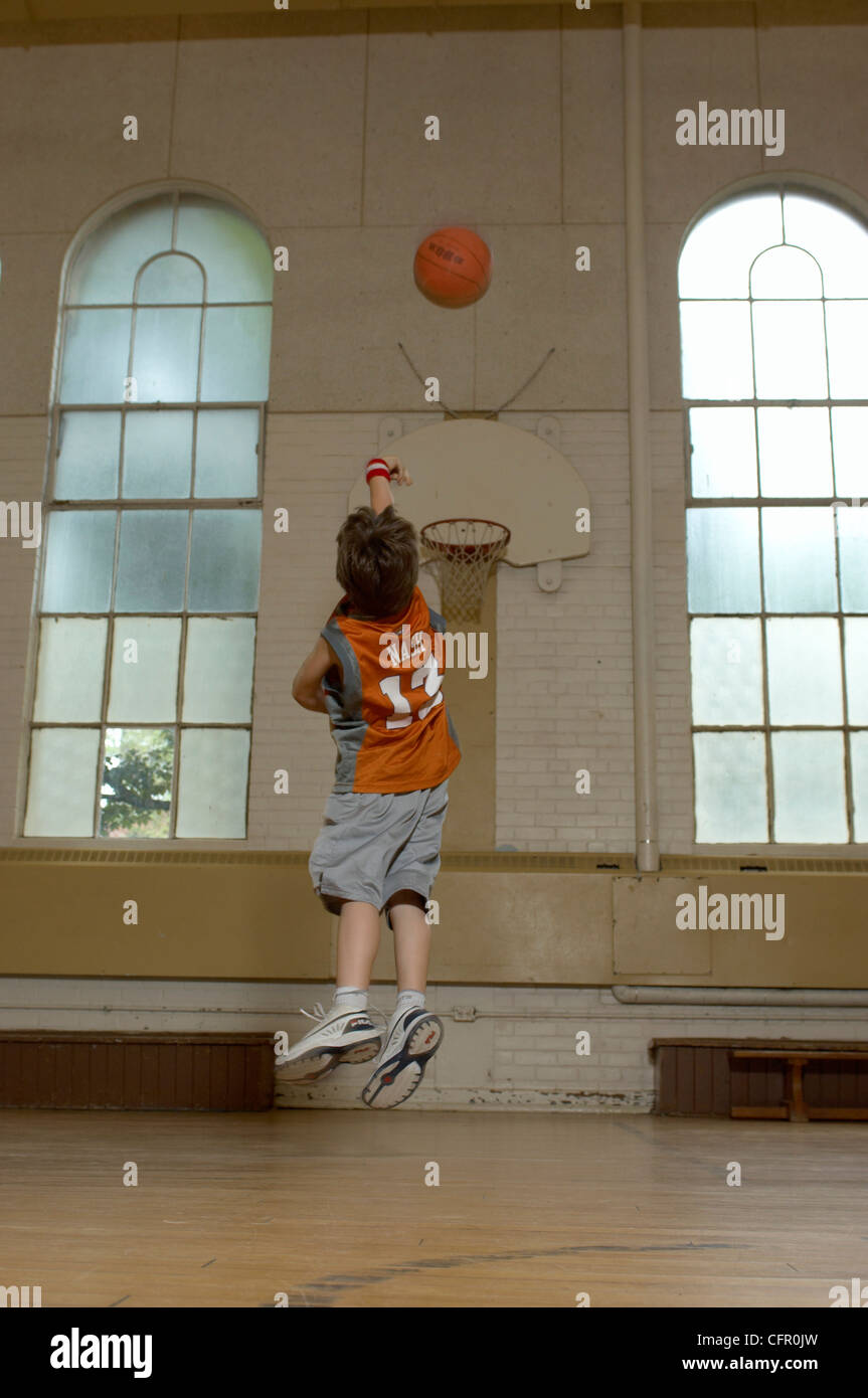 Boy Shooting Basketball Stock Photo - Alamy