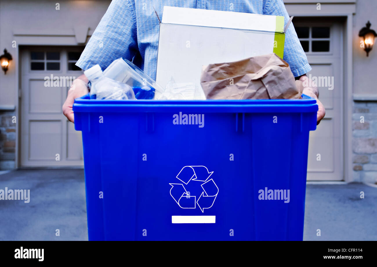 Person Carrying Recycle Bin Stock Photo - Alamy