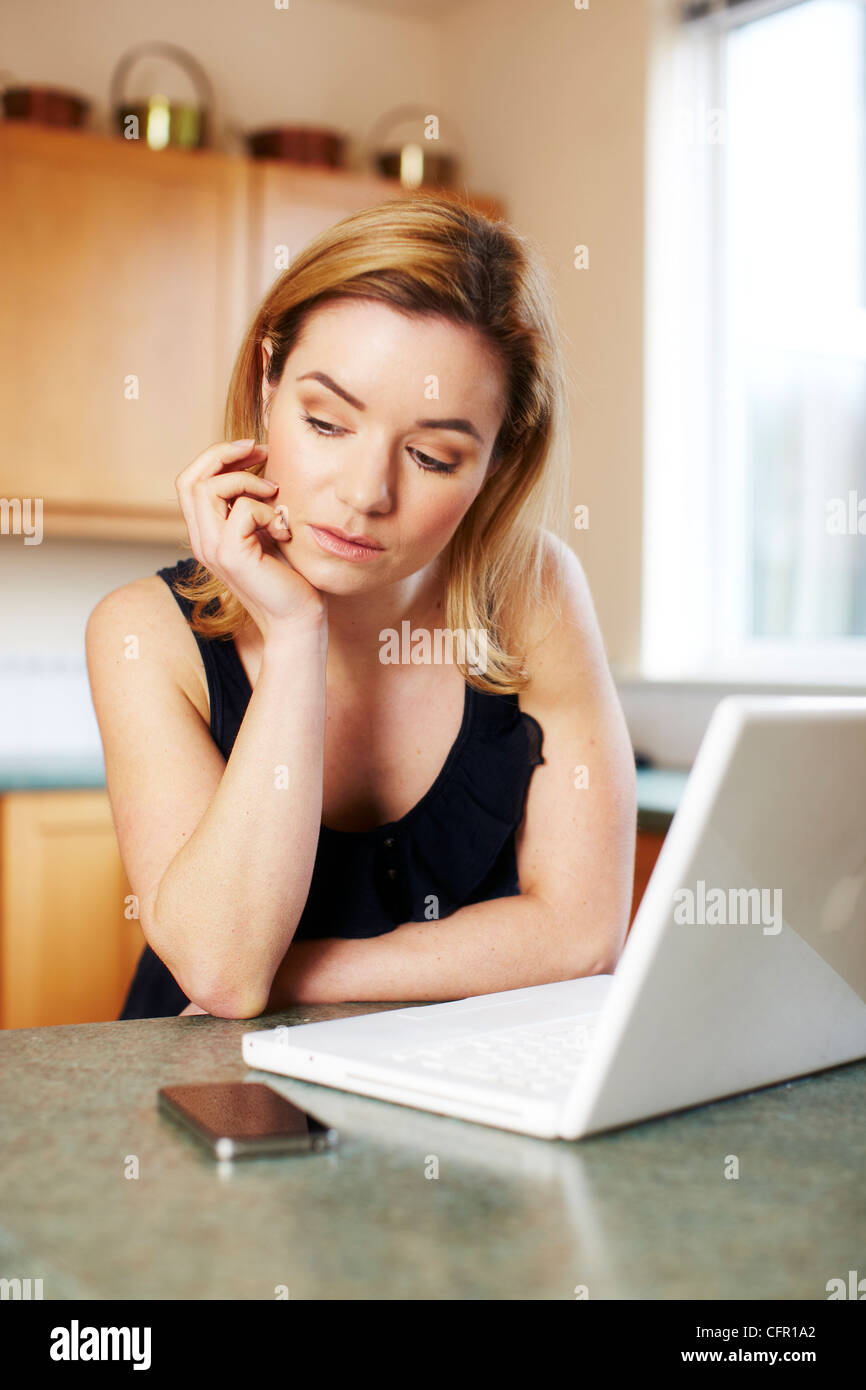 Stressed girl using laptop Stock Photo - Alamy