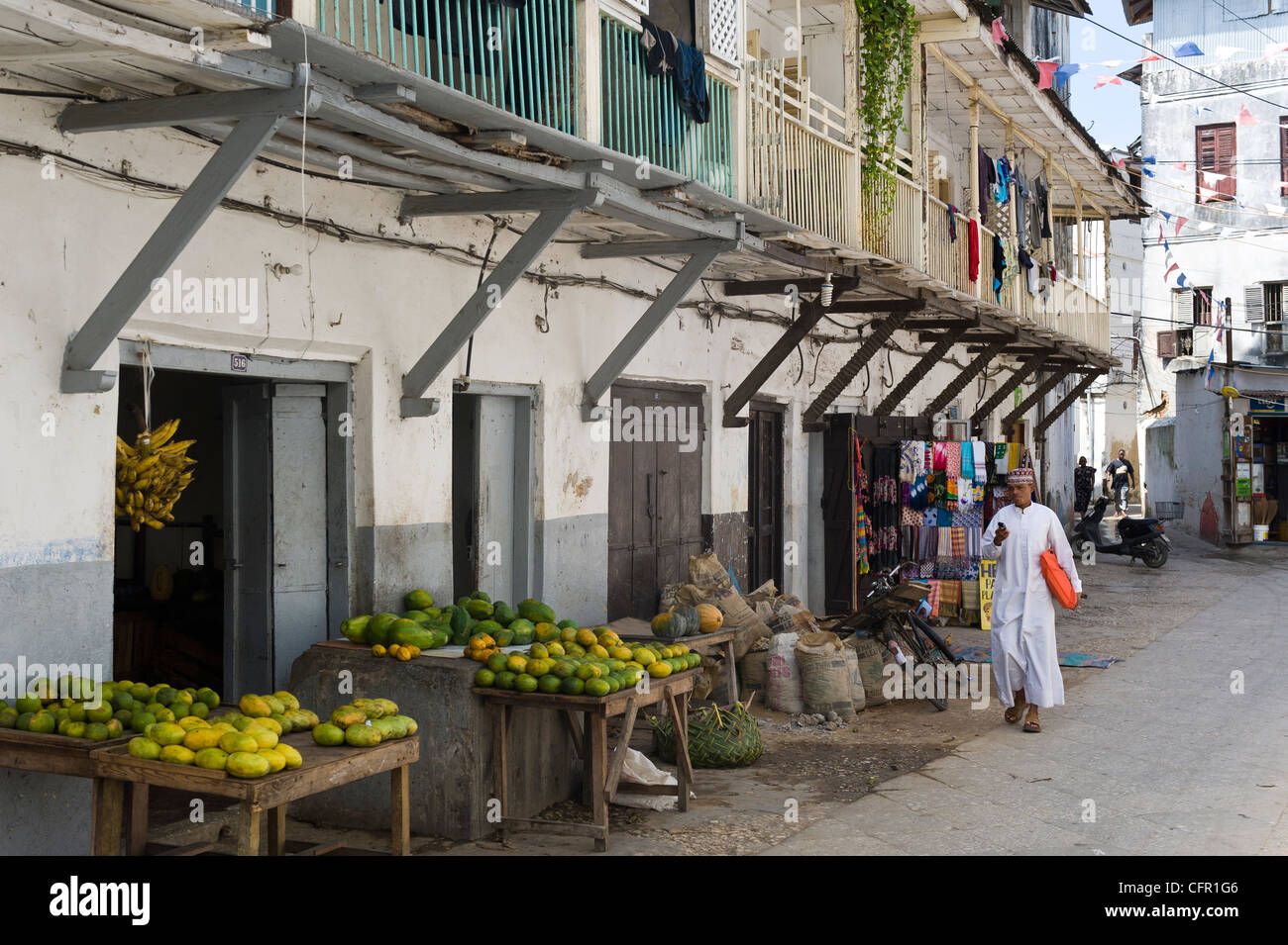 Shops with fruits and garments in Stone Town Zanzibar Tanzania Stock ...