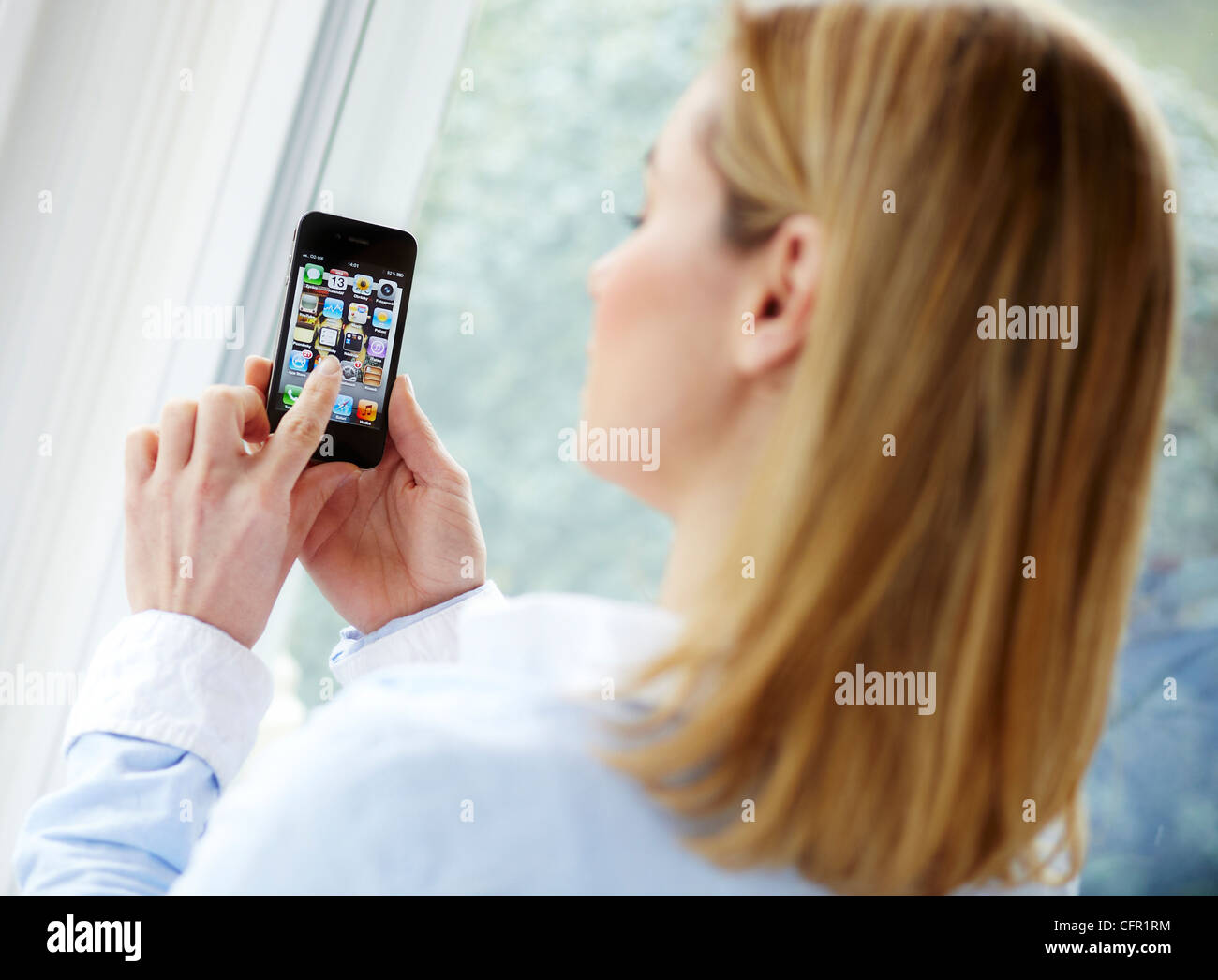 Girl using iPhone Stock Photo - Alamy
