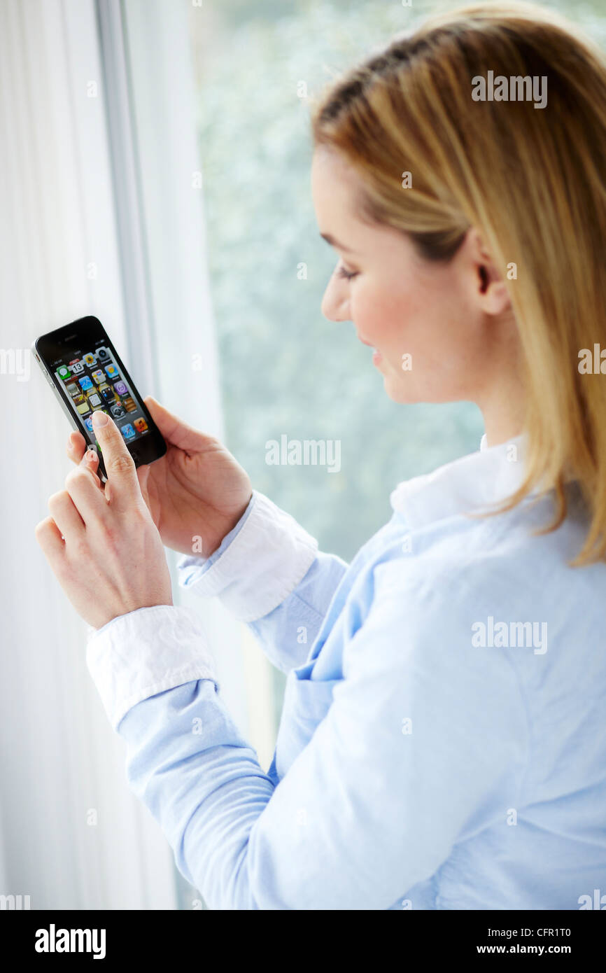 Girl using iPhone Stock Photo - Alamy
