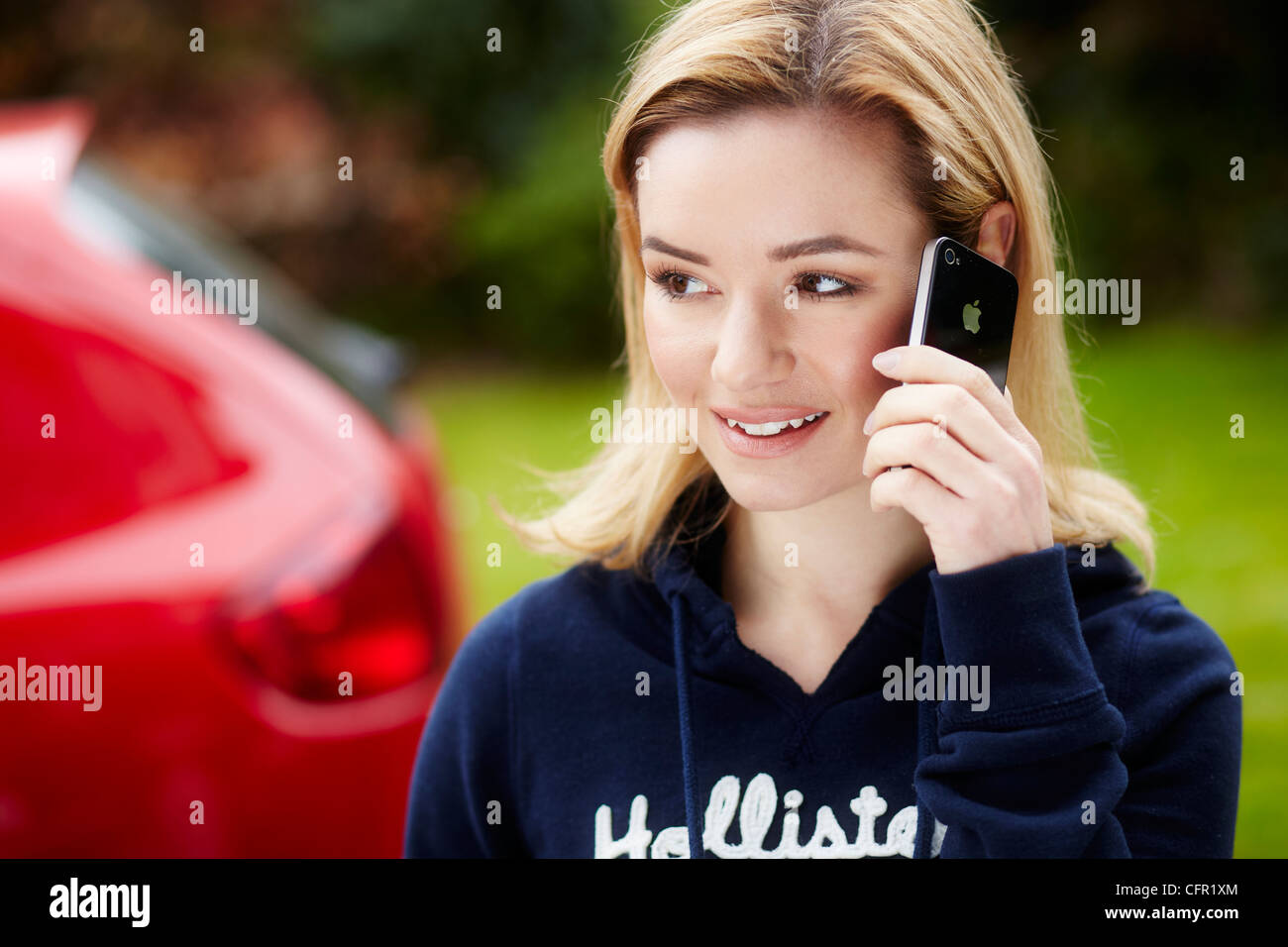 Girl using iPhone Stock Photo - Alamy
