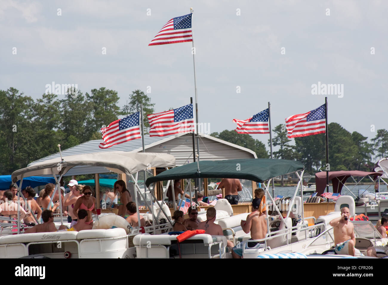Rock the dock summer lake party Stock Photo - Alamy