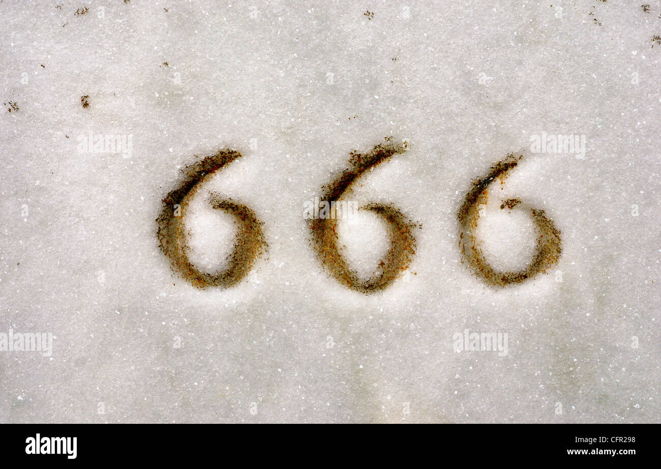 Macro of numbers 666 engraved on granite headstone Stock Photo - Alamy