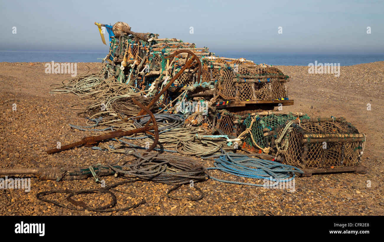 fishing pots stacked on the shingle ready for next fishing trip Stock ...