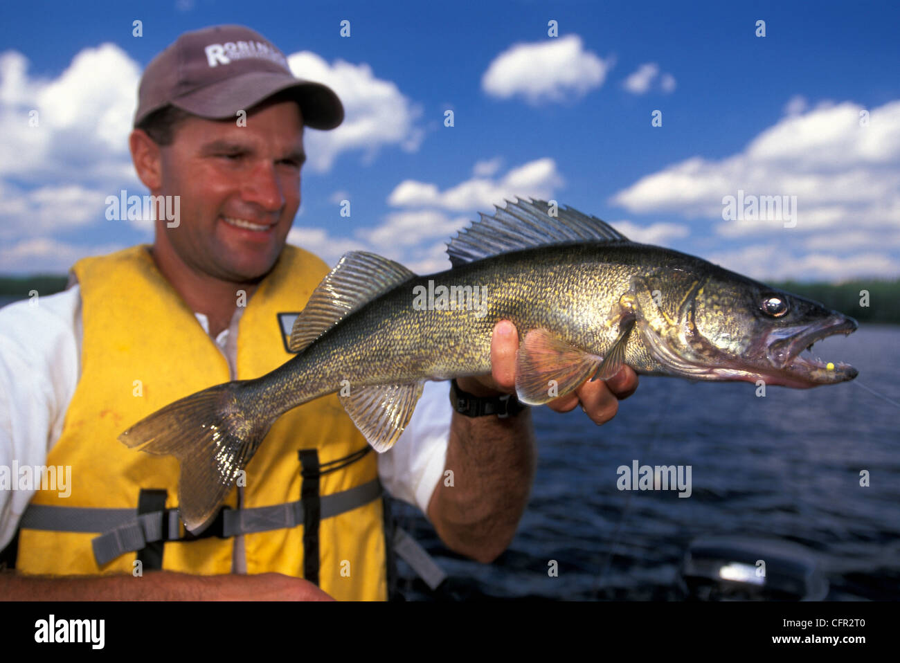 Man with Walleye, Northern Ontario Lake Stock Photo - Alamy