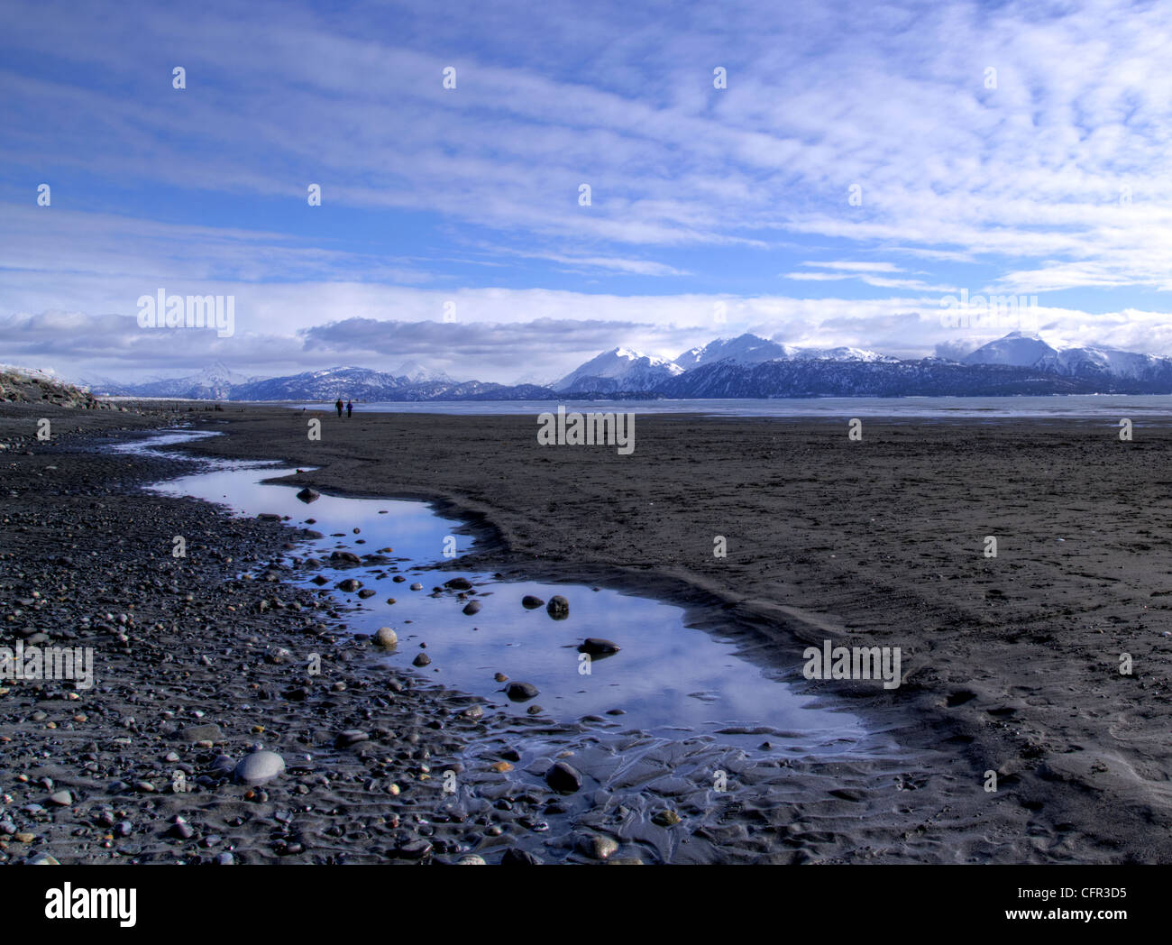 Alaskan beach at low tide near Homer Alaska on a sunny day with clouds ...
