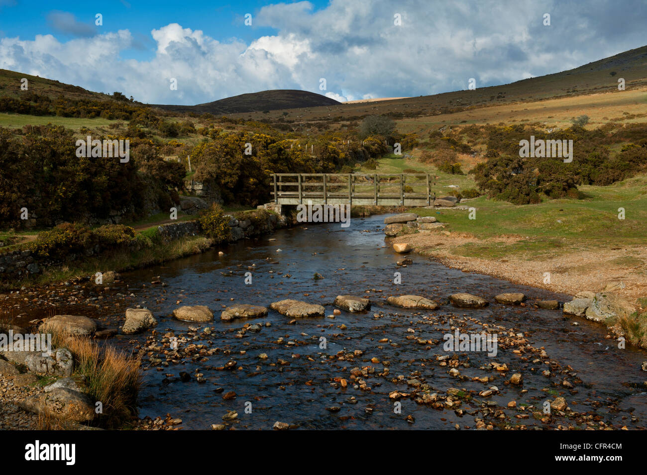 River Lyd with stepping stones and footbridge leading to Great Nodden ...
