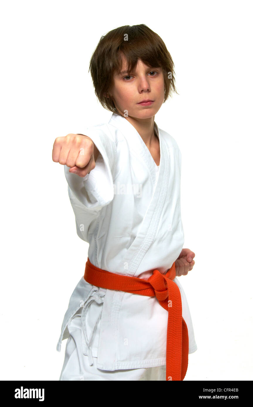 boy practicing karate on white background Stock Photo - Alamy