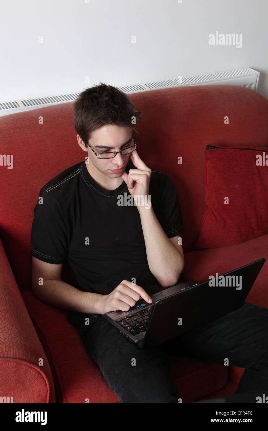Teen boy glasses working on hi-res stock photography and images - Alamy