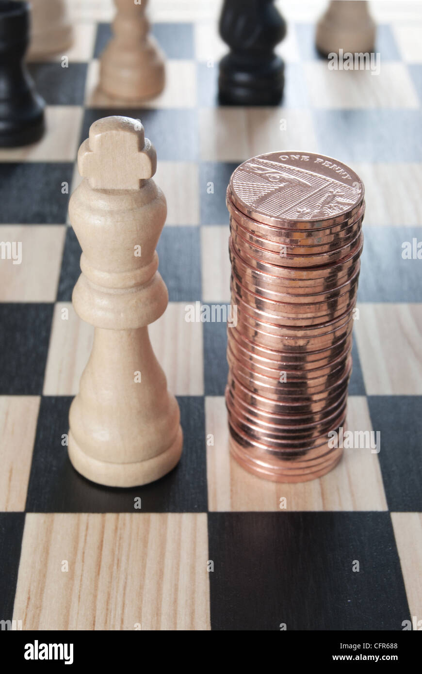 Money coins on chess hi-res stock photography and images - Alamy