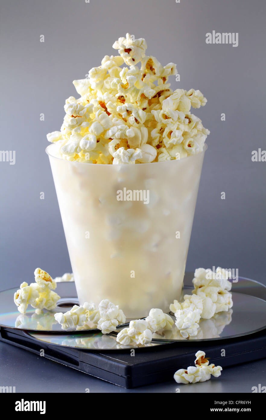 cup of popcorn and DVD disks Stock Photo - Alamy