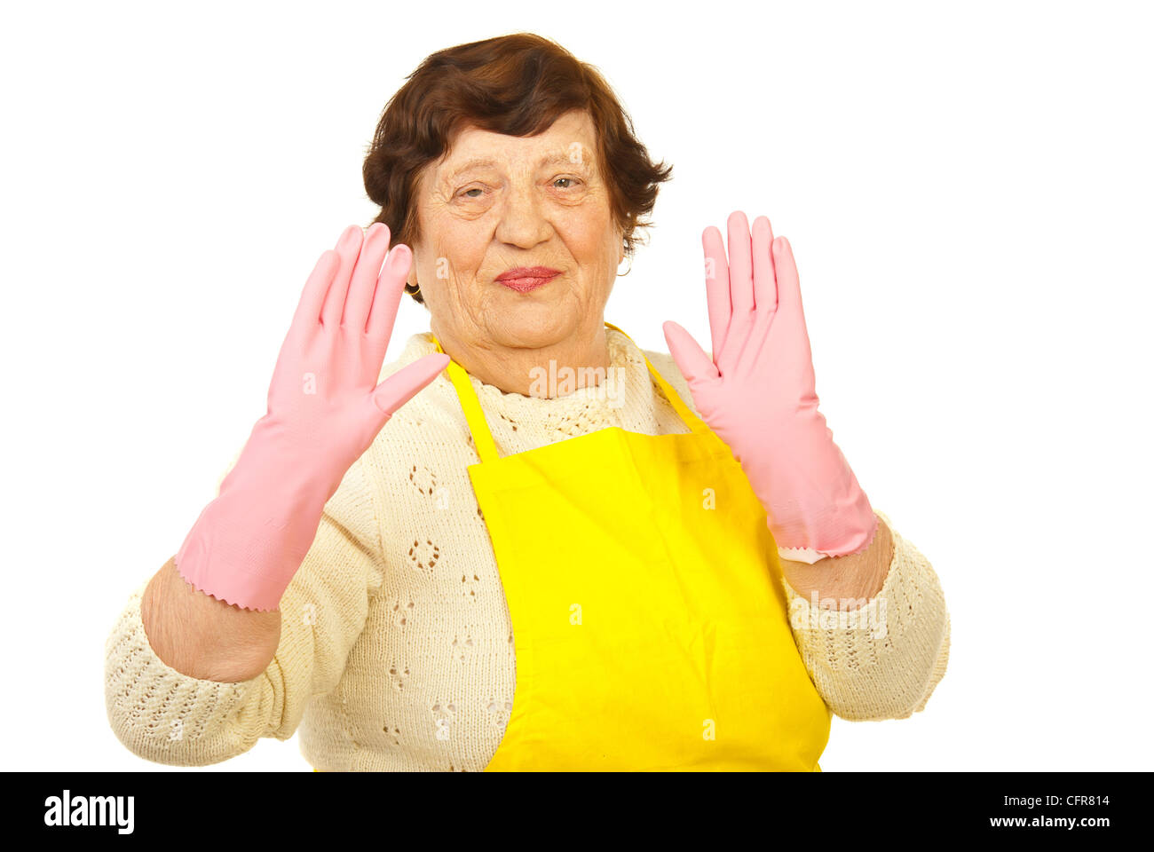 Joyful Elderly Housewife Showing Her Palms In Pink Gloves Isolated On