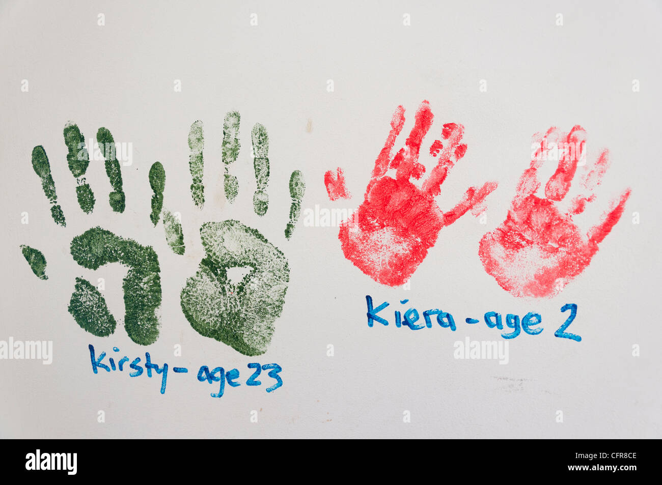 Child and adult hand prints Stock Photo - Alamy