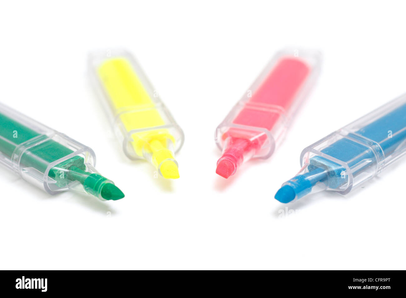 Four markers on a white background Stock Photo - Alamy